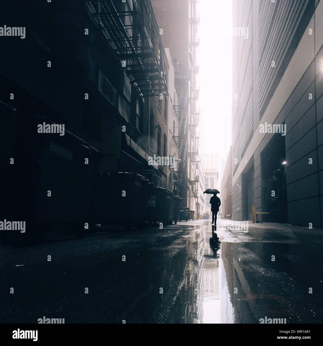 Man walking down street hi-res stock photography and images - Alamy