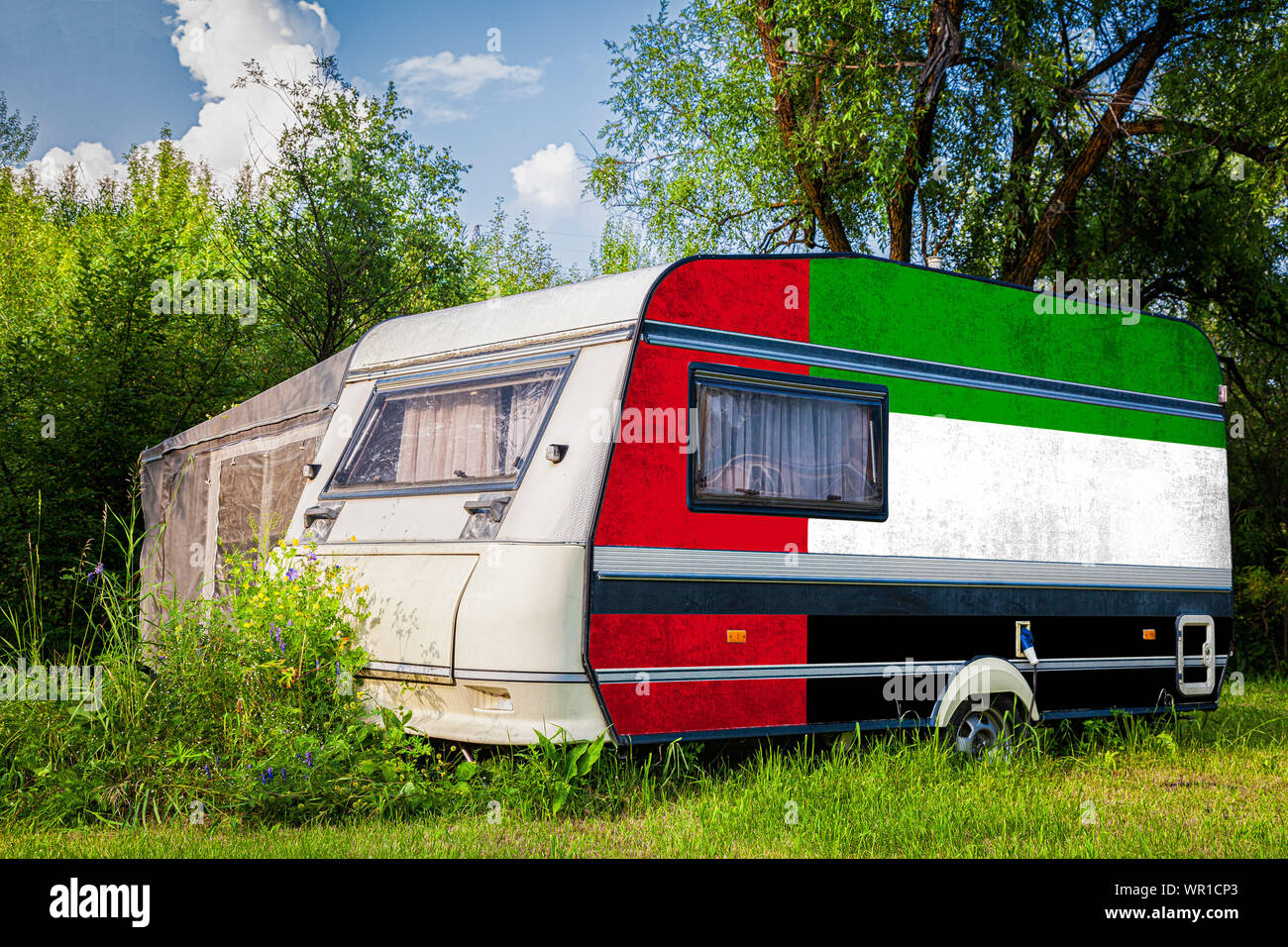 A car trailer, a motor home, painted in the national flag of United ...