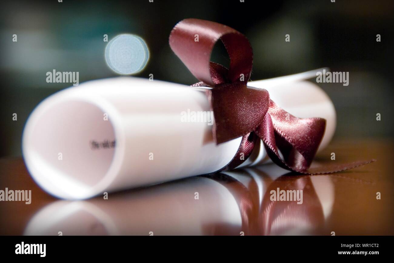 Rolled up graduation diploma scroll hi-res stock photography and images ...