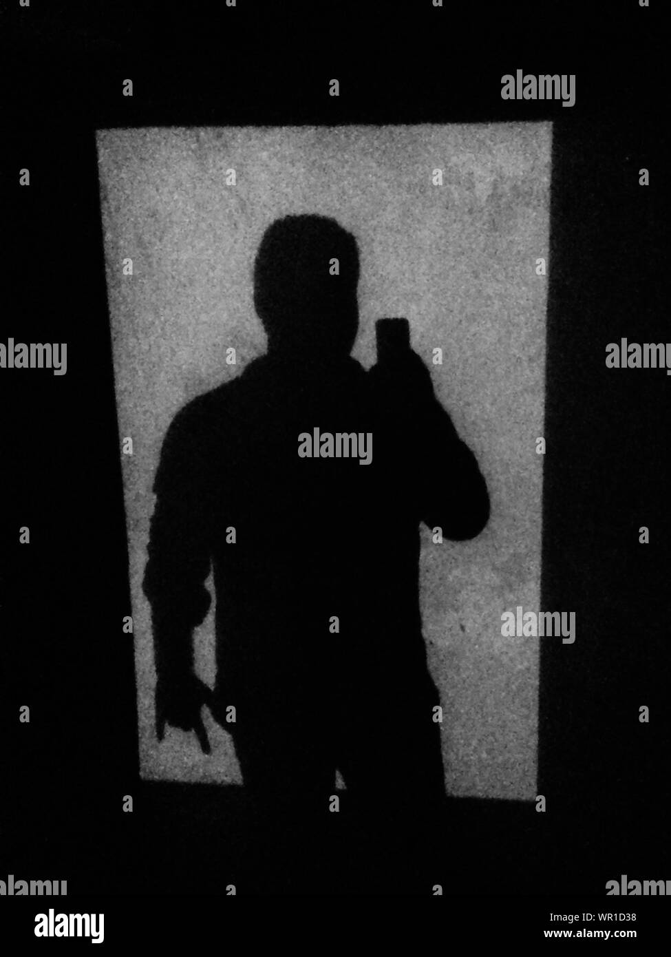 Man shadow wall silhouette Black and White Stock Photos & Images - Alamy
