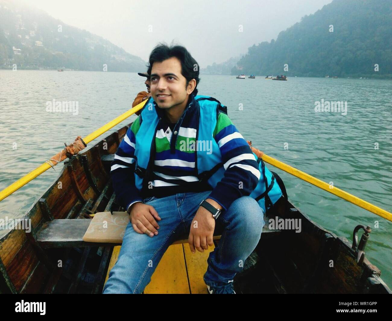 Indian man sitting on boat hi-res stock photography and images - Alamy