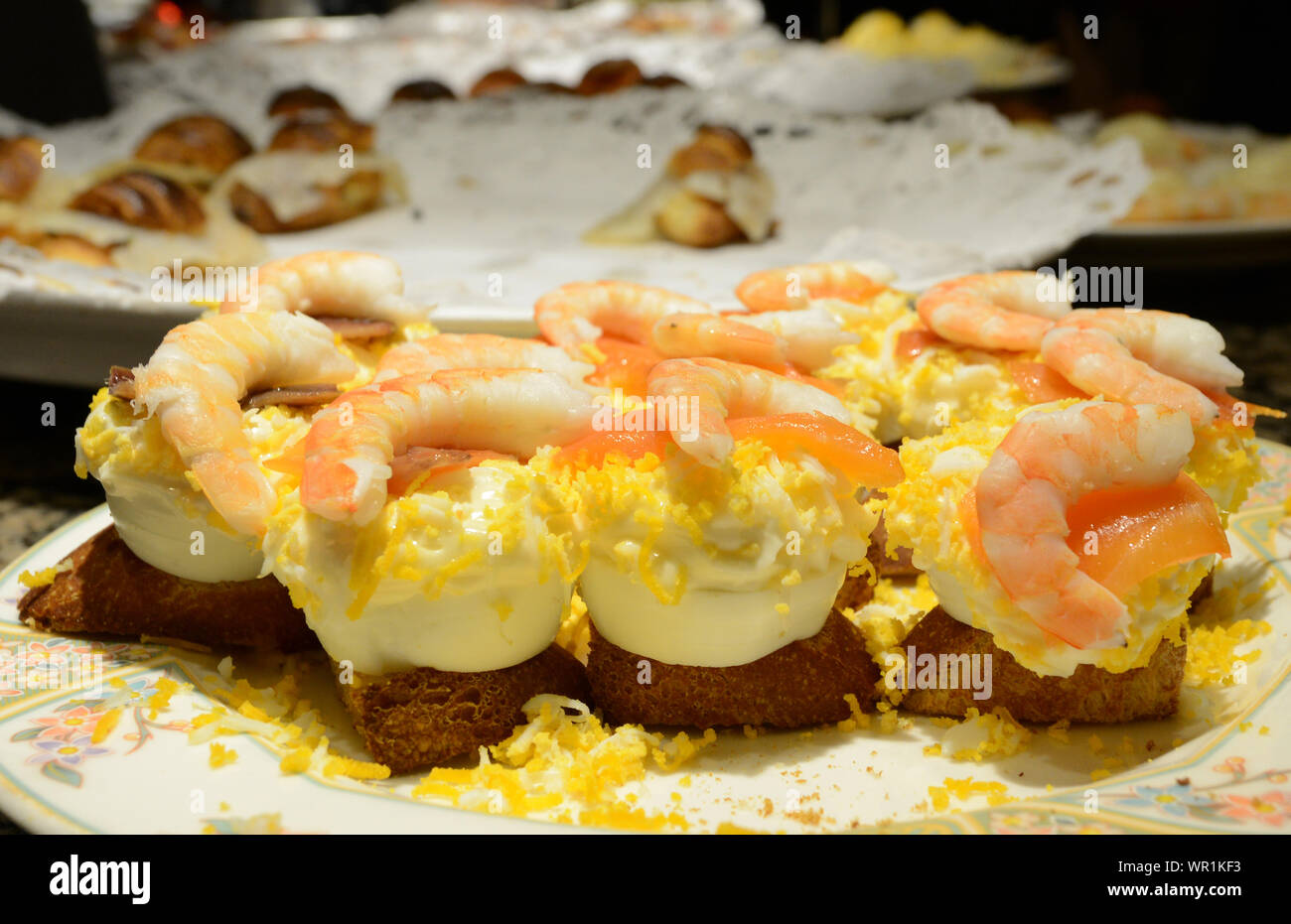 Pintxos served on the bar of a popular pintxo bar in San Sebastian ...