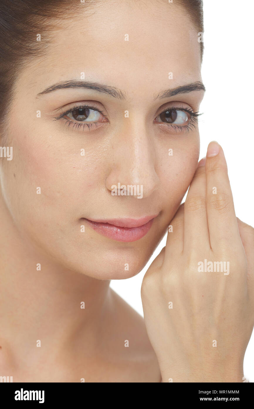 Portrait of a beautiful young woman touching soft skin Stock Photo - Alamy