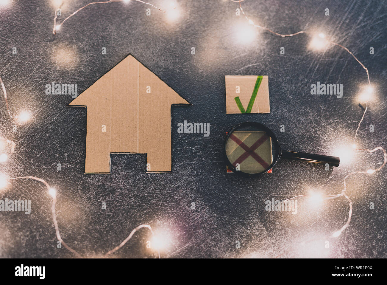buying or moving house concept, miniature cardboard house with green ...