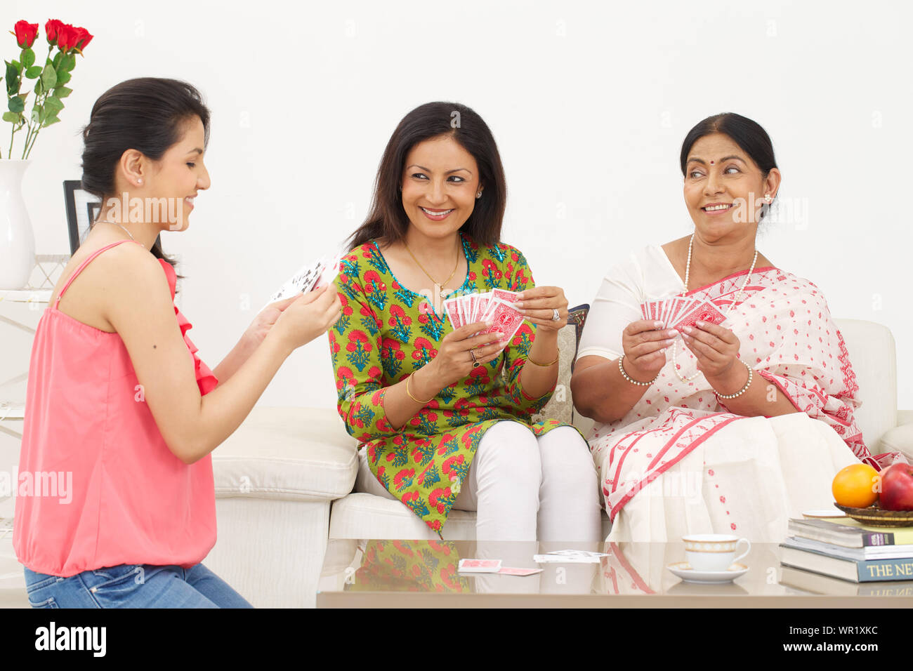 Family playing cards at home Stock Photo - Alamy