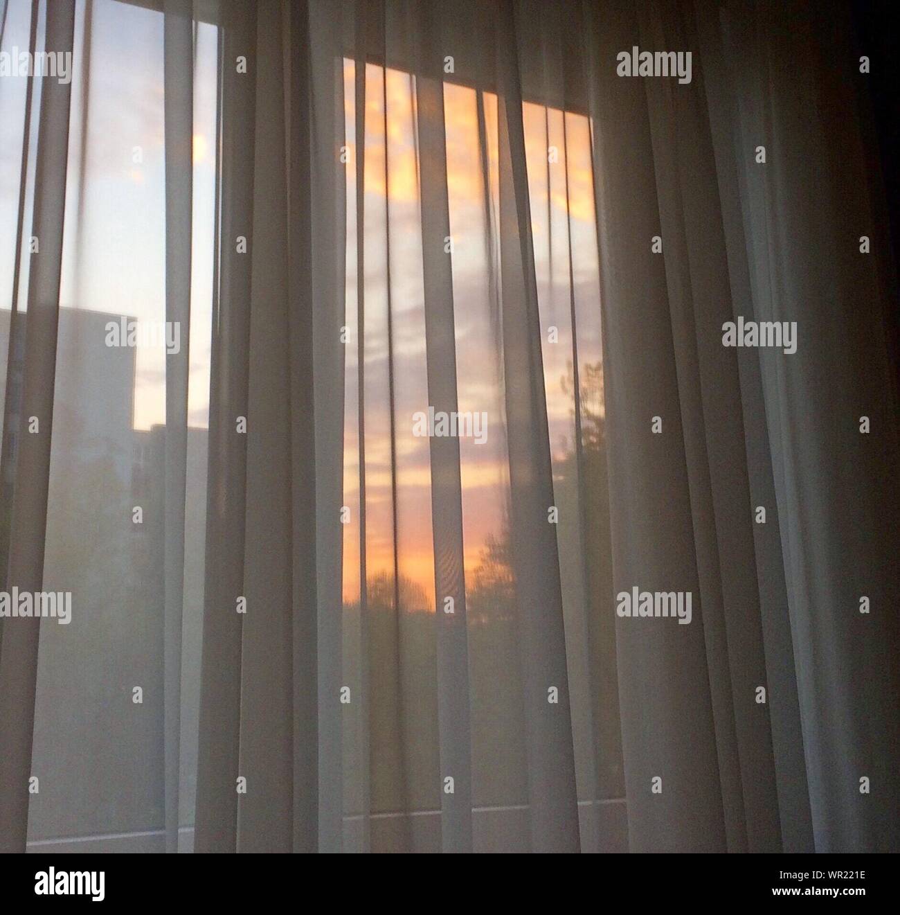 Sunset through curtains hi-res stock photography and images - Alamy