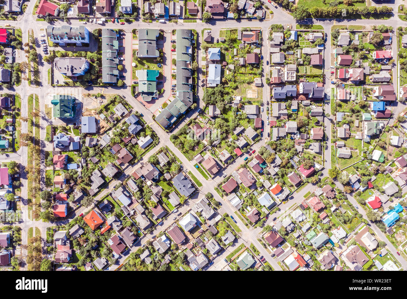 aerial view from the drone of urban houses and streets in a residential ...