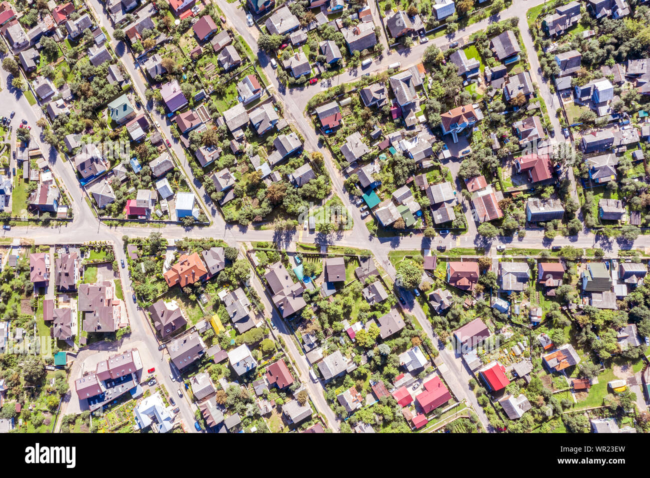 aerial top view flying over city residential area with real estate ...