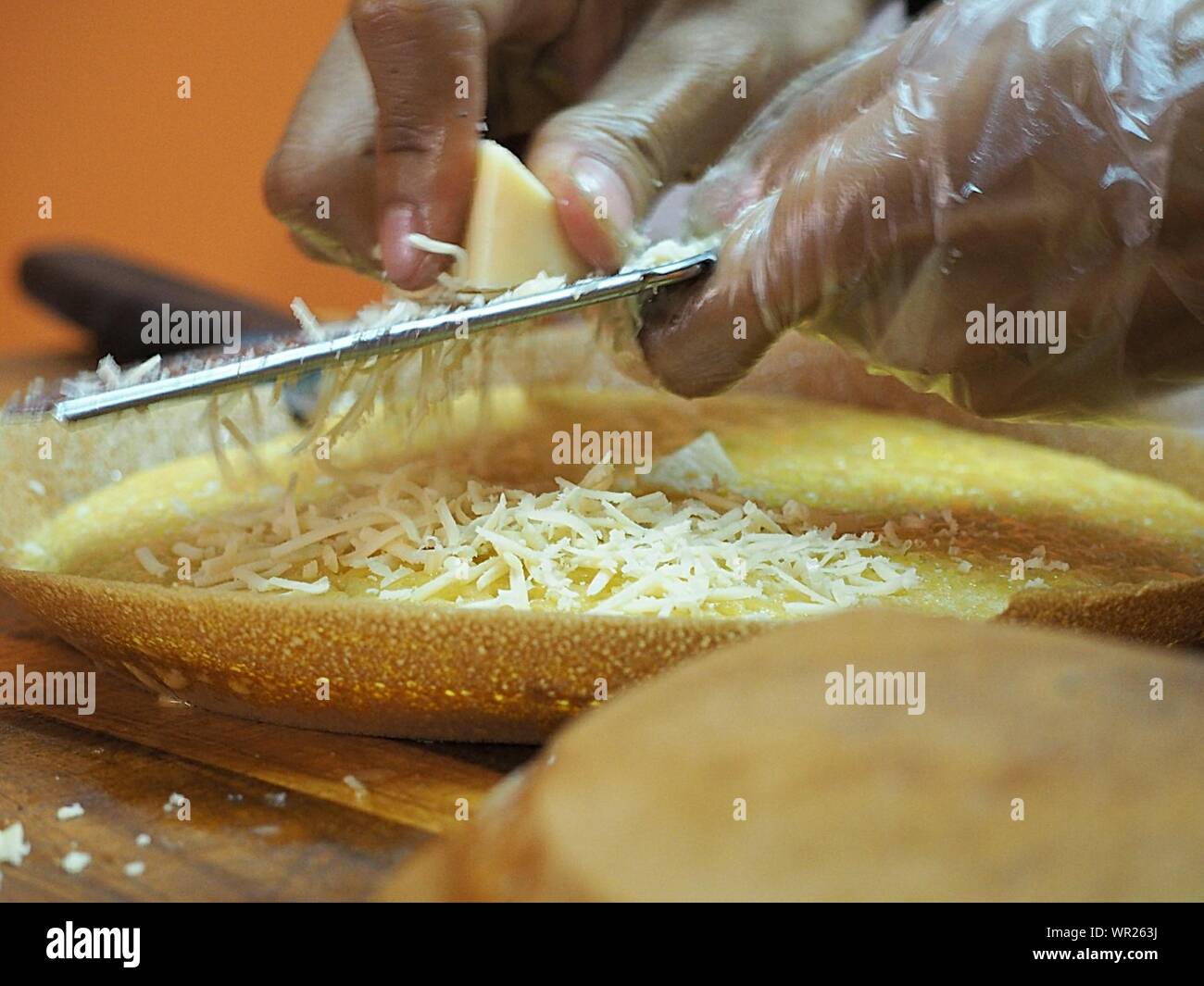 Grating cheese hi-res stock photography and images - Alamy