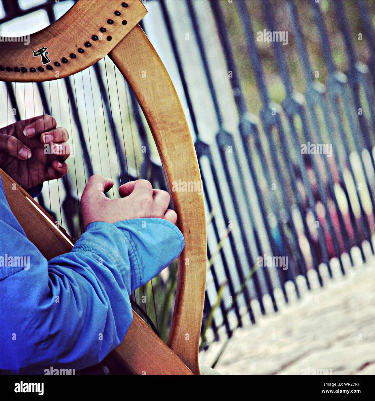 Person playing harp hi-res stock photography and images - Alamy