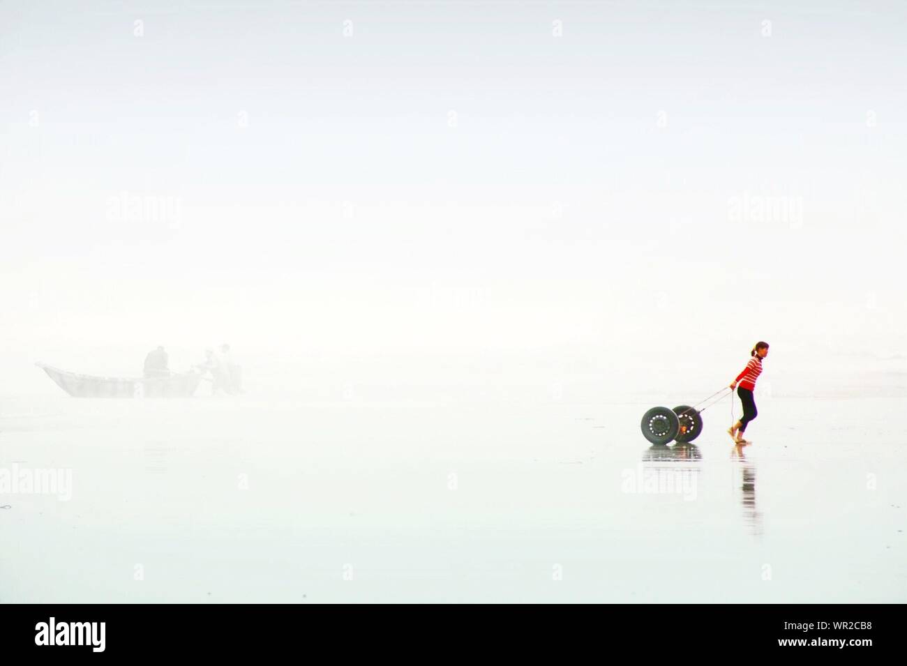 Woman pulling rope hi-res stock photography and images - Alamy