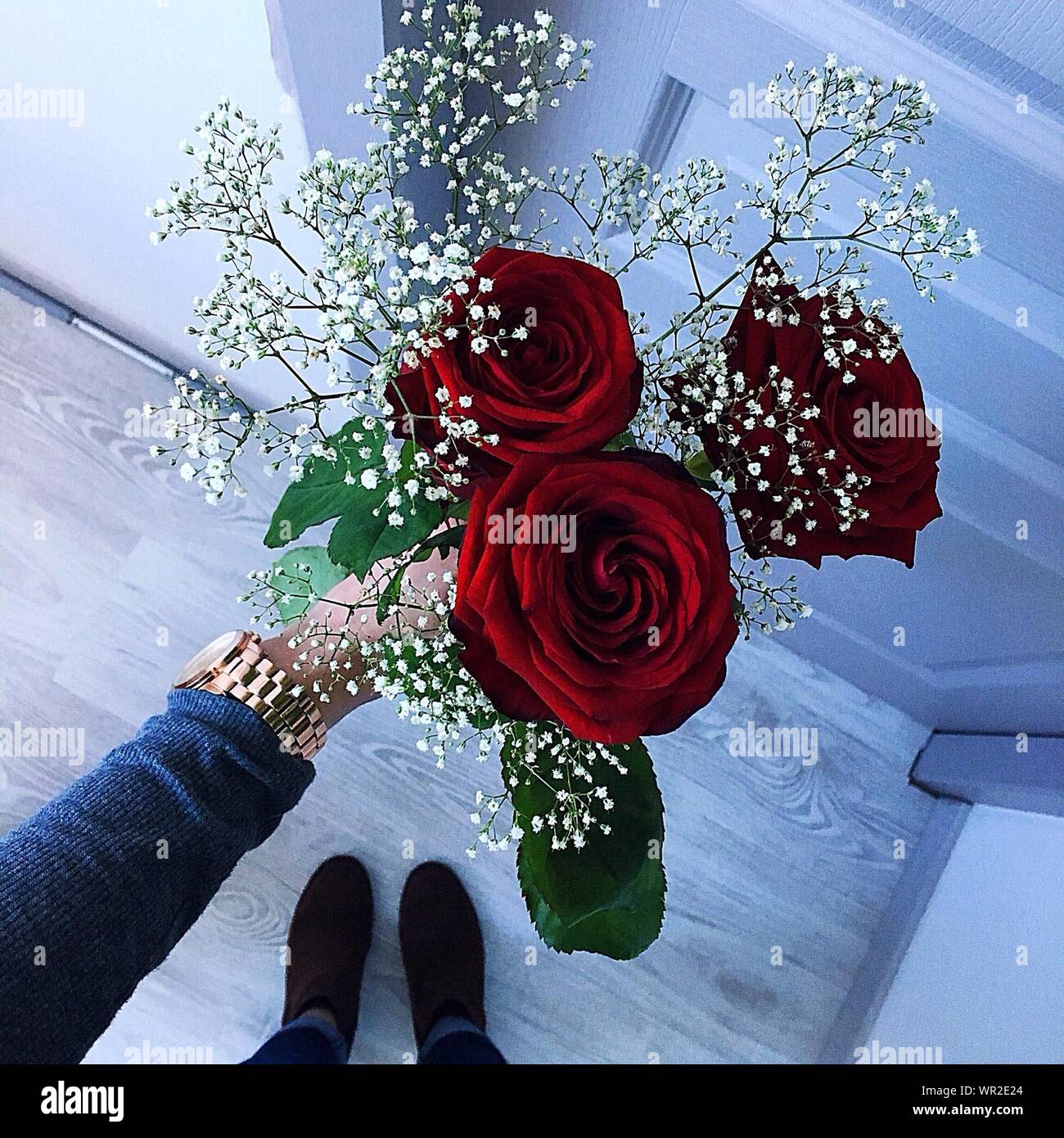 Man holding rose bouquet hi-res stock photography and images - Alamy