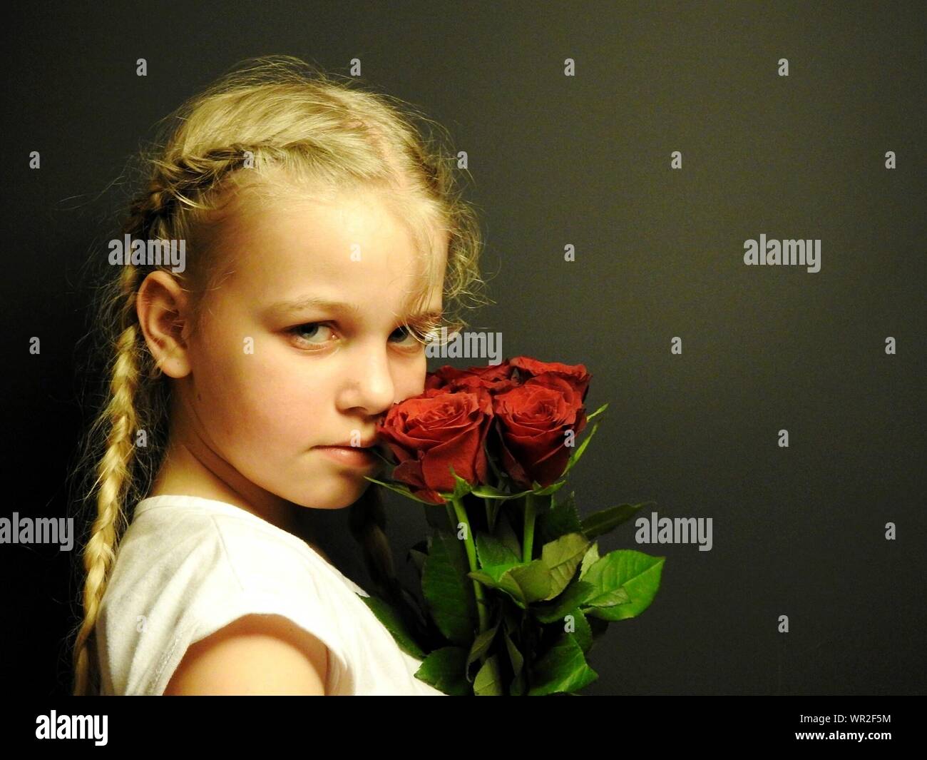 Girl holding rose hi-res stock photography and images - Alamy
