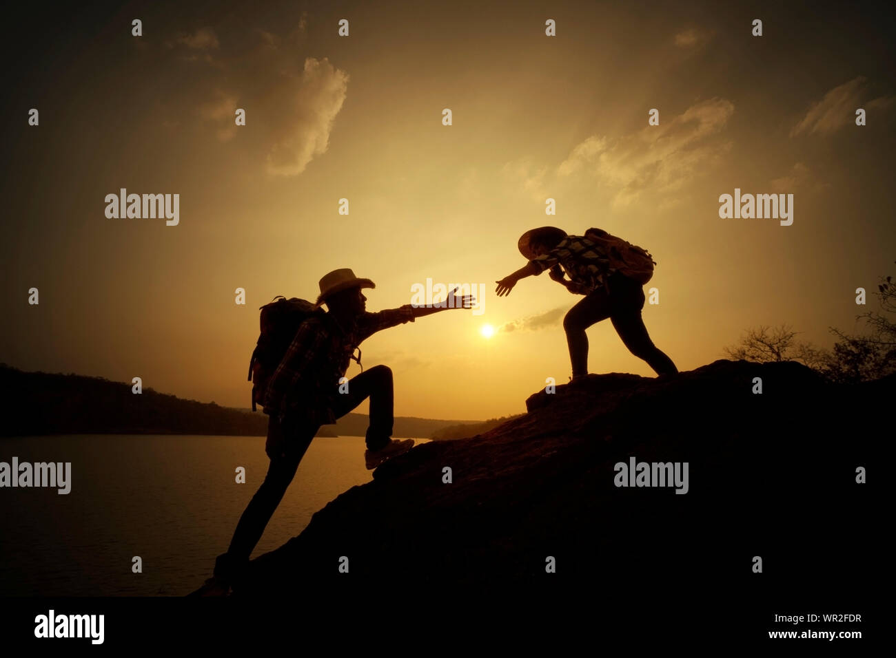 Helping hand mountain climbing hi-res stock photography and images - Alamy