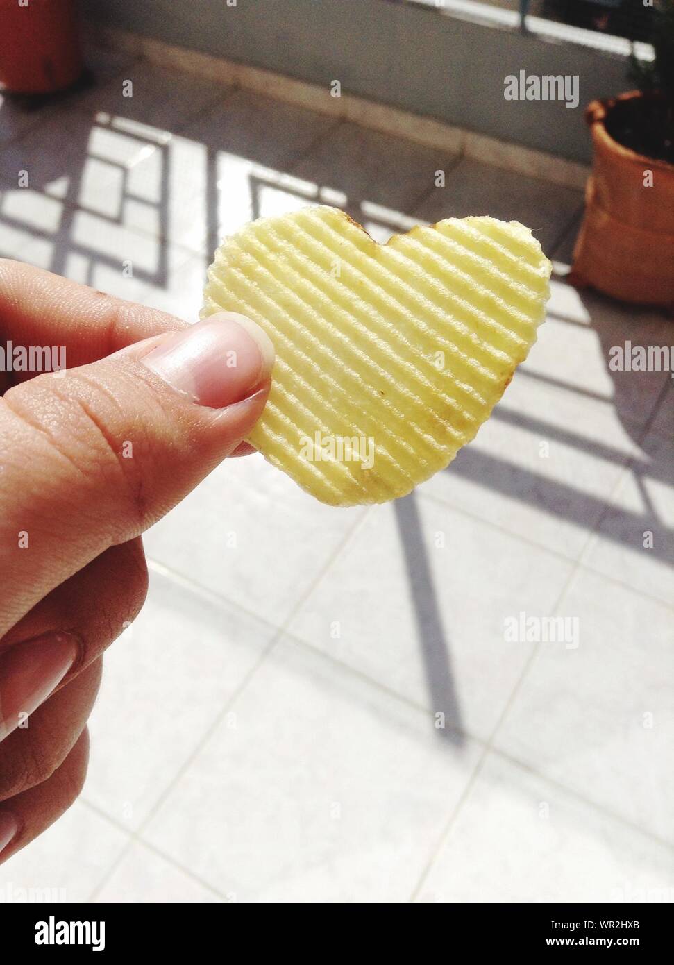 Hand holding chips hi-res stock photography and images - Alamy