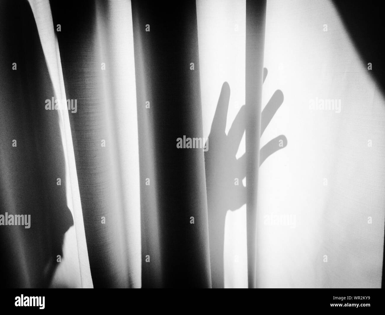 Shadow Of Human Hand On White Curtain Stock Photo - Alamy