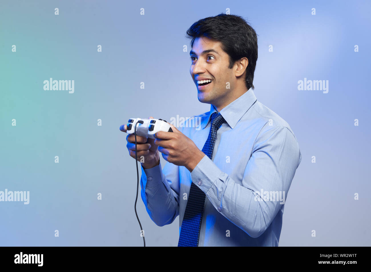 Businessman playing video game Stock Photo - Alamy
