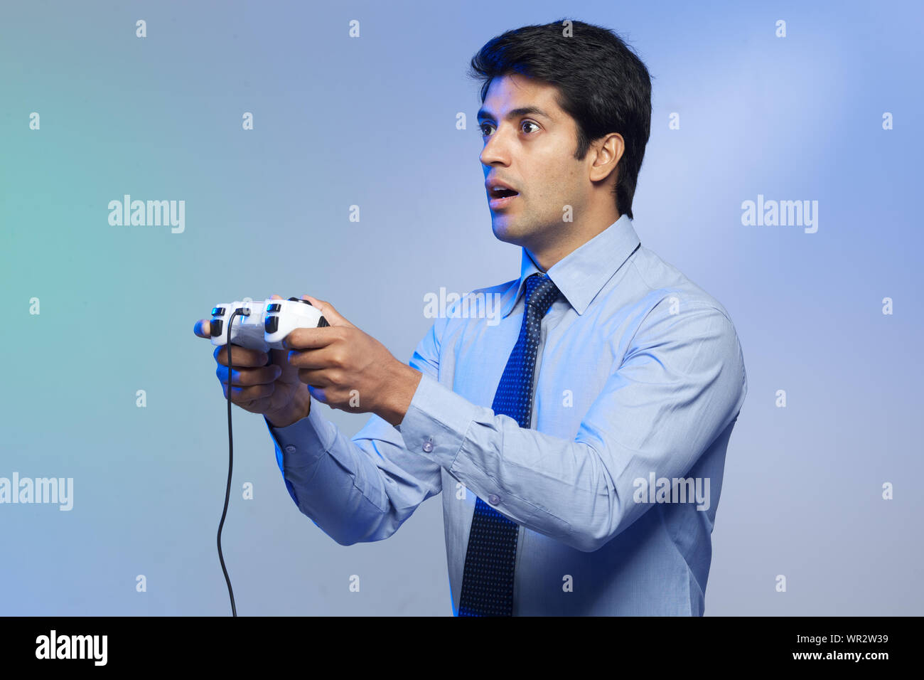 Businessman playing video game Stock Photo - Alamy