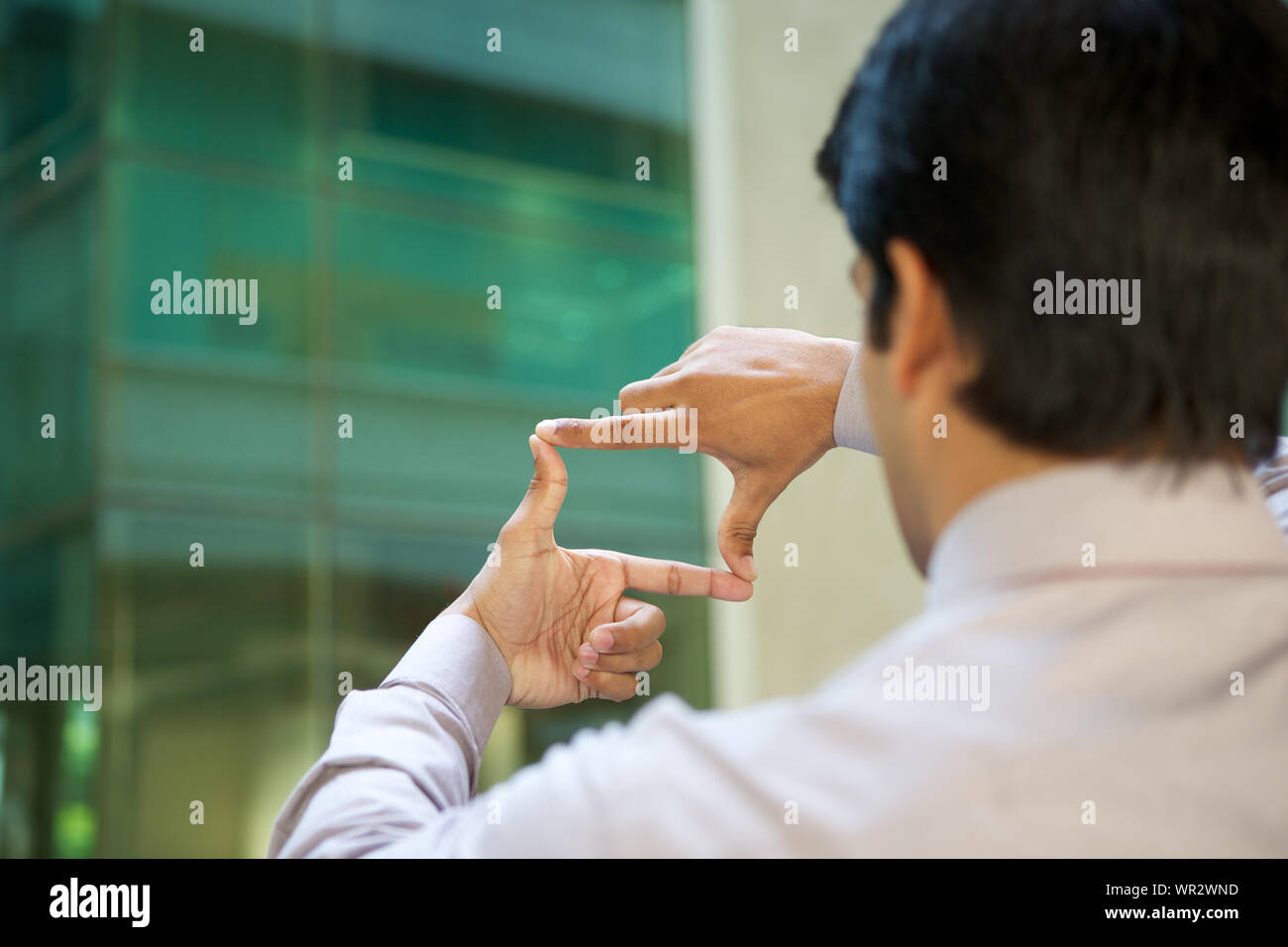 Man hands framing office Stock Photo - Alamy