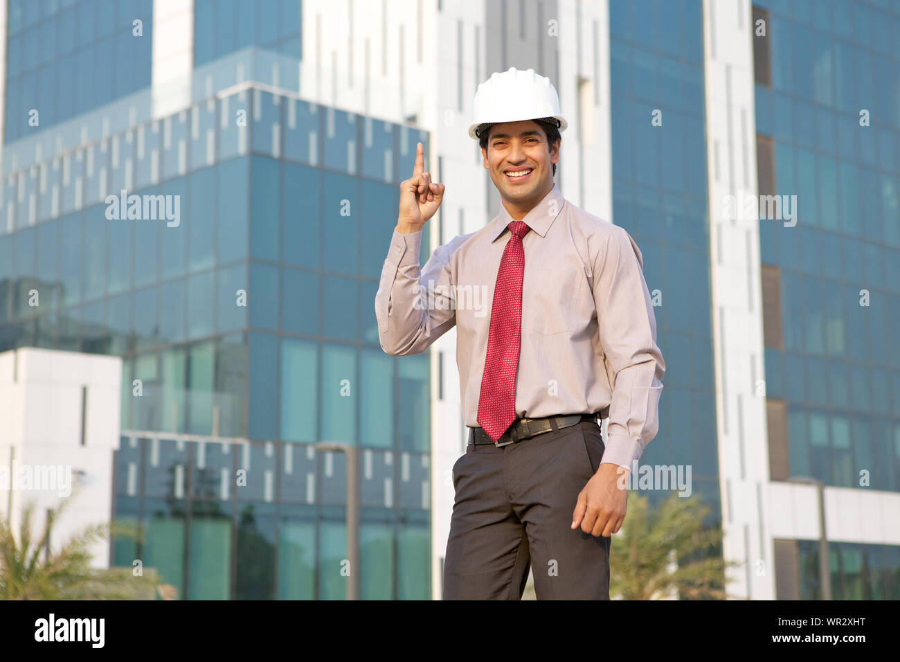 Architect standing and pointing upward Stock Photo - Alamy