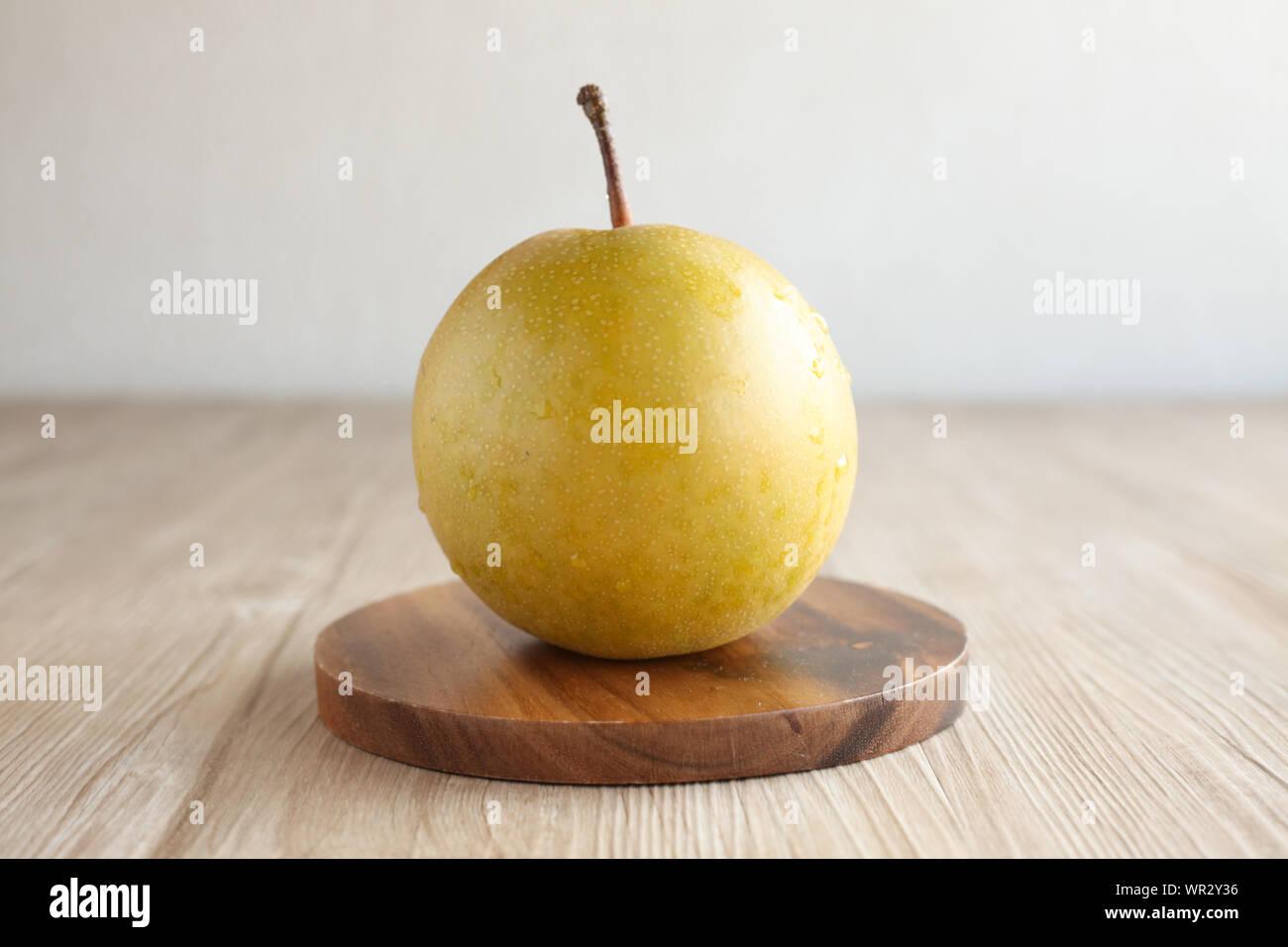 Japanese pear nashi closeup isolated on table Stock Photo - Alamy