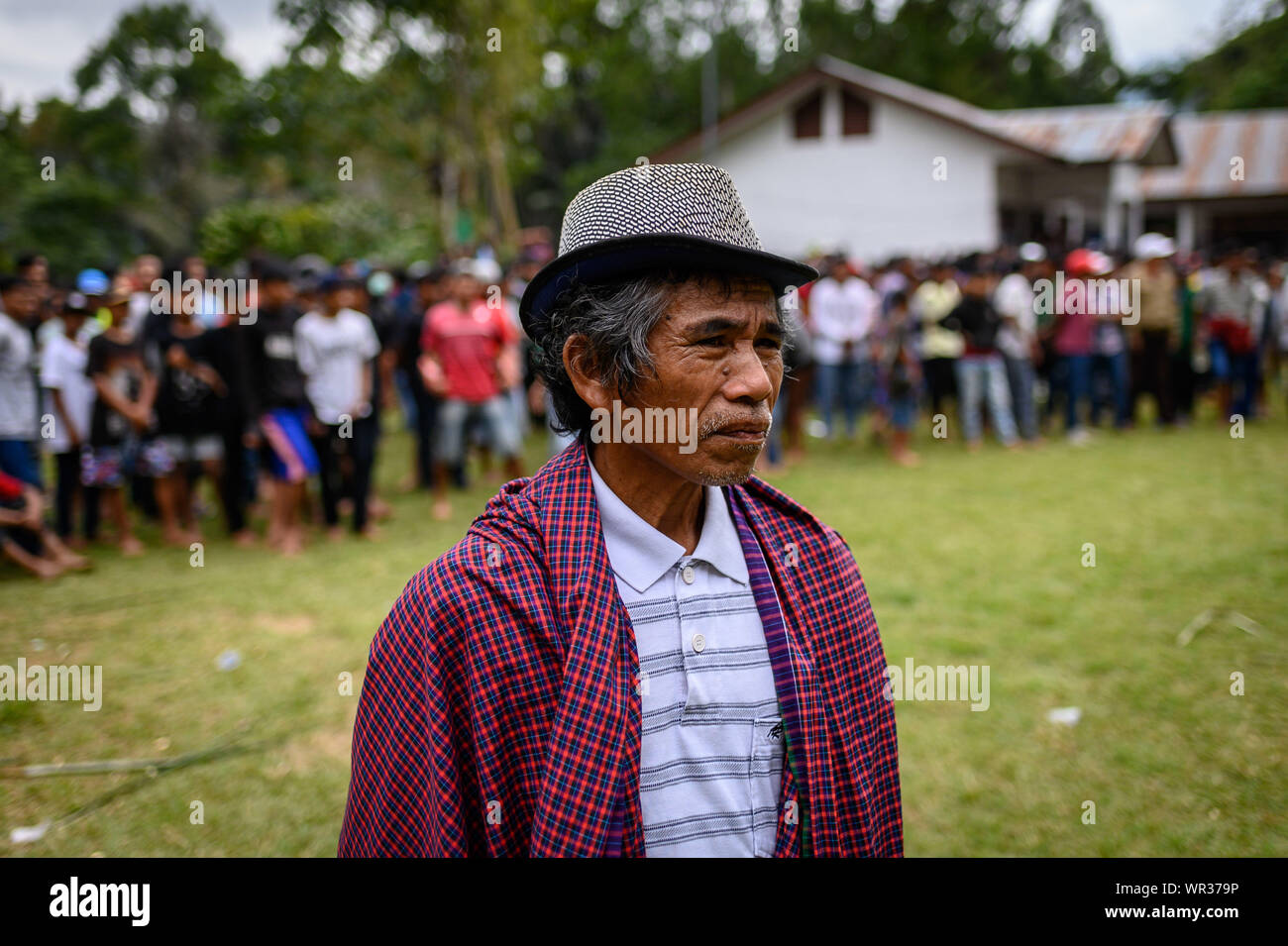 Indigenous leader looks on during the tradition in Toraja Utara.Sisemba ...