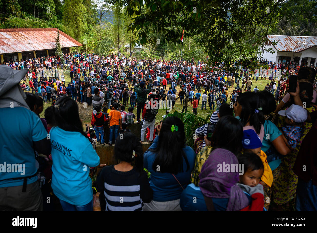 Residents gather during the tradition in Toraja Utara.Sisemba in Toraja ...