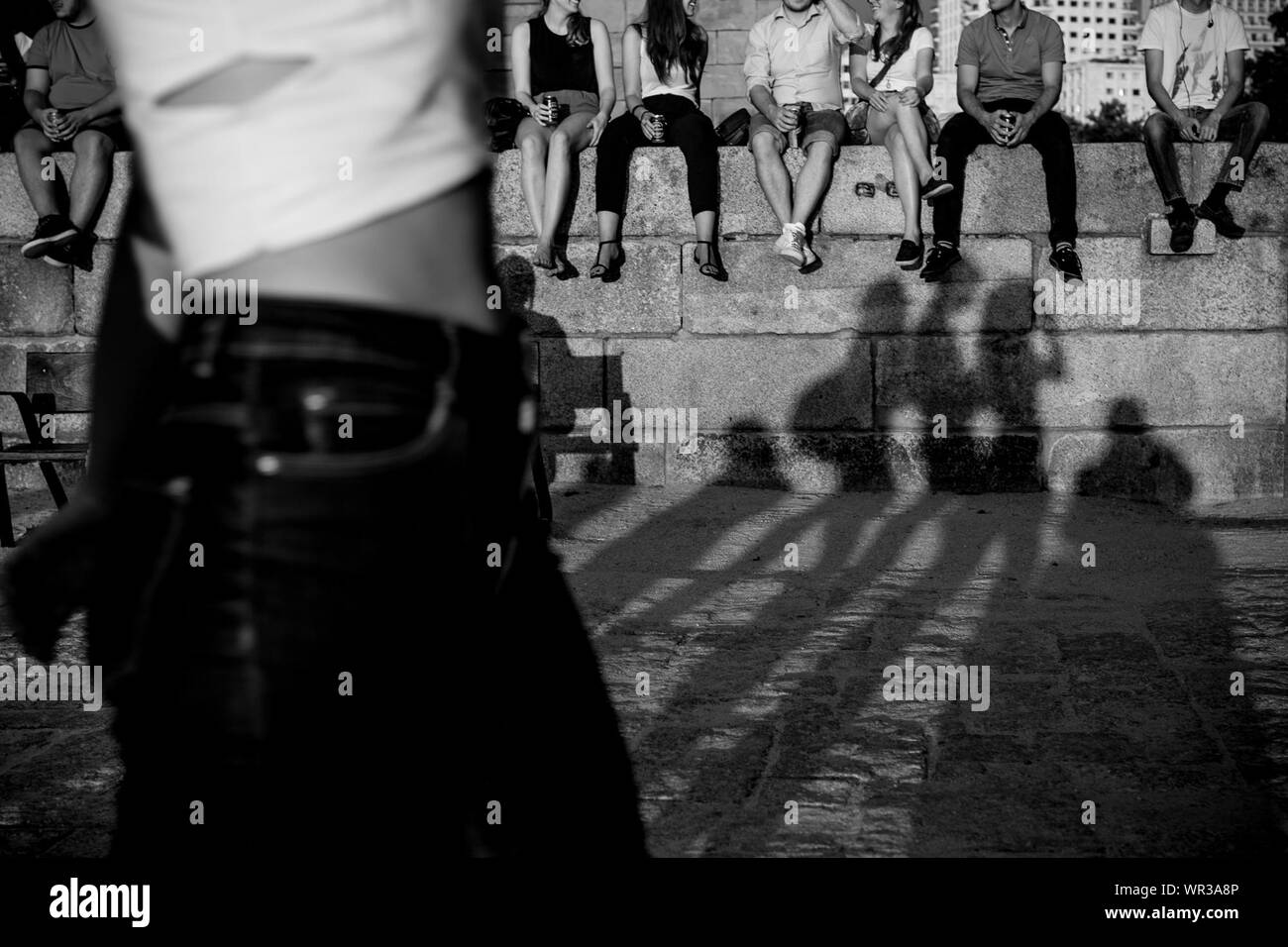 People Sitting Shadow Wall High Resolution Stock Photography and Images ...