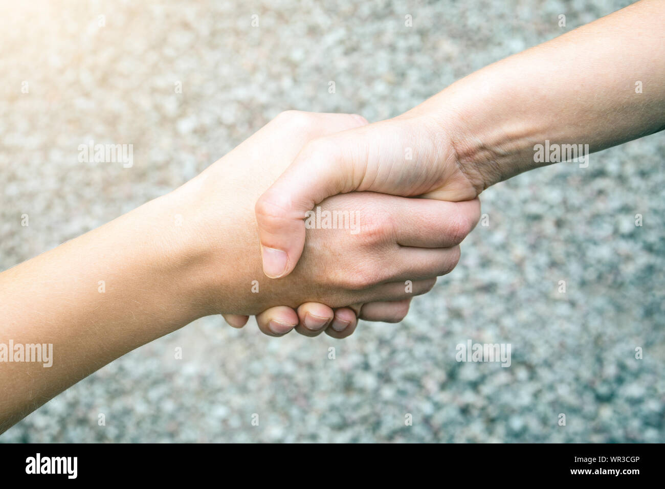 Handshake. People shaking hands, finishing up a meeting Stock Photo - Alamy