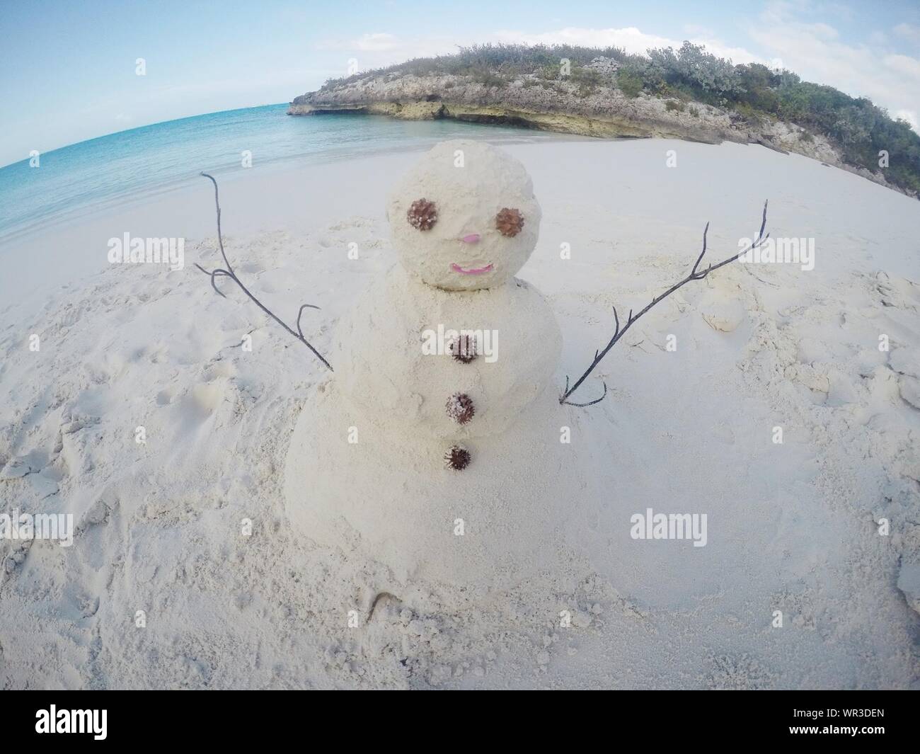 Snowman Made Of Sand At Beach Stock Photo - Alamy