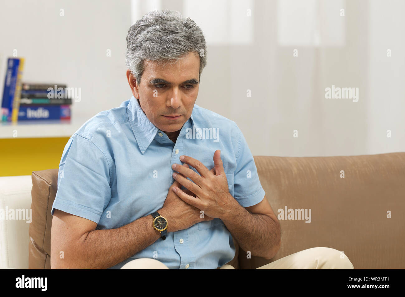 Senior man suffering from chest pain Stock Photo - Alamy
