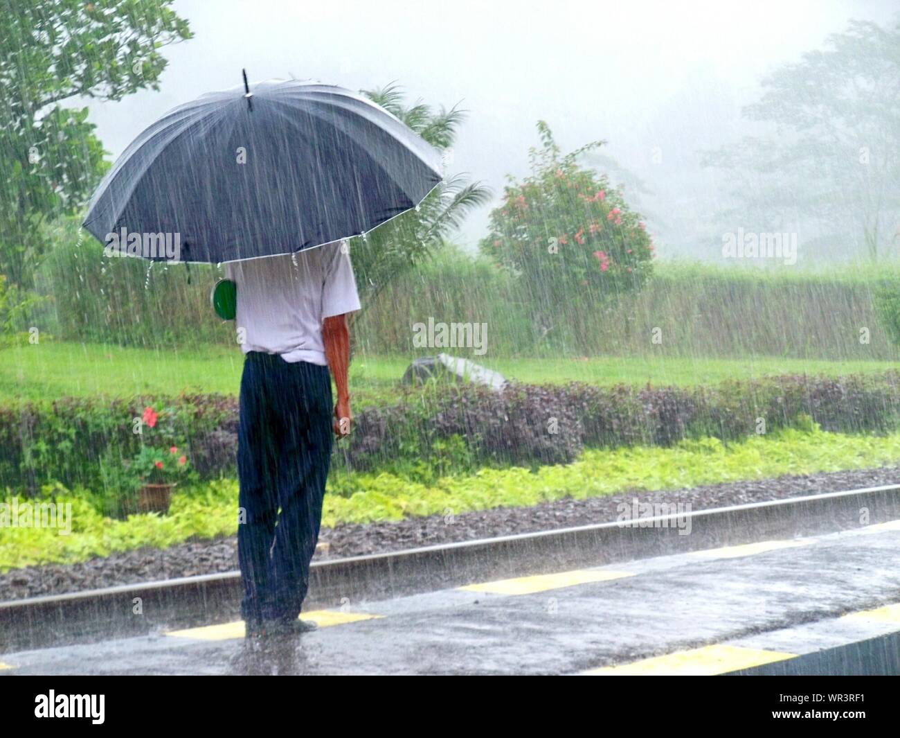 Man Standing In Rain High Resolution Stock Photography and Images - Alamy