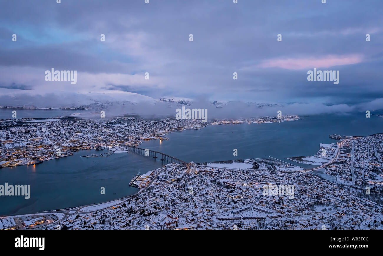 Aerial view to the city of Tromso in winter from the mountain ledge ...
