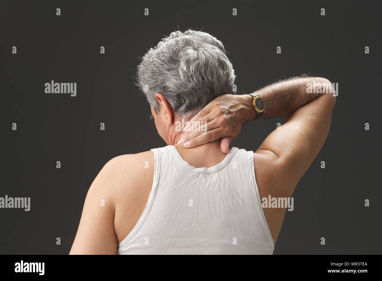 Old man suffering from neck pain Stock Photo - Alamy
