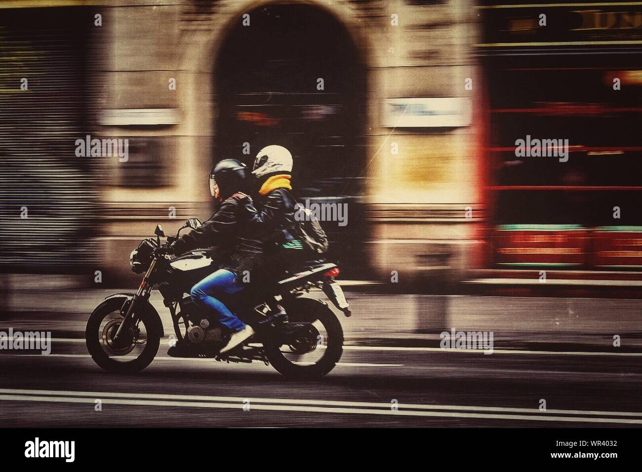 Couple riding on motorcycle hi-res stock photography and images - Alamy