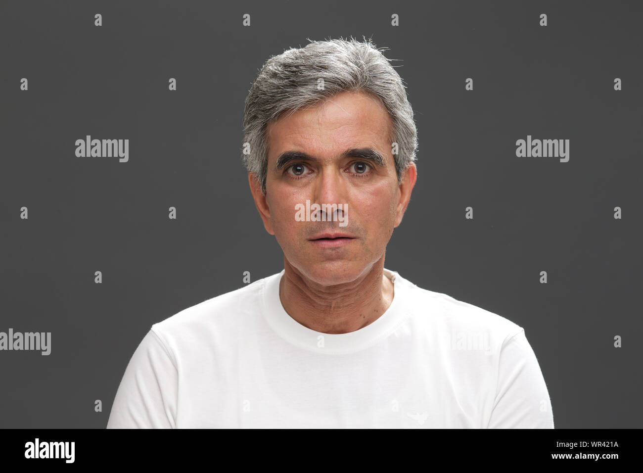 Portrait of a senior man looking angry Stock Photo - Alamy