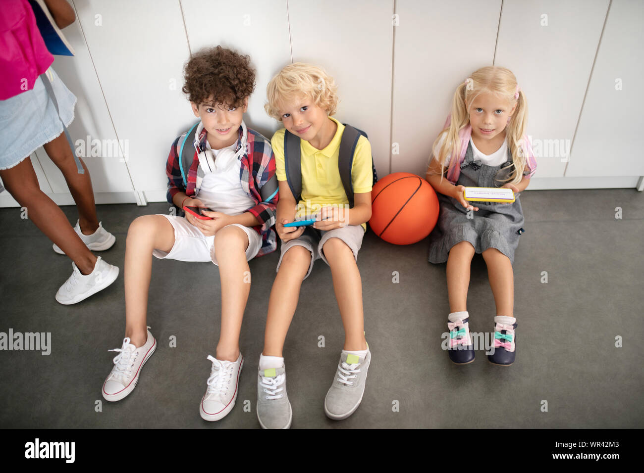 Children playing video games while having school break Stock Photo - Alamy