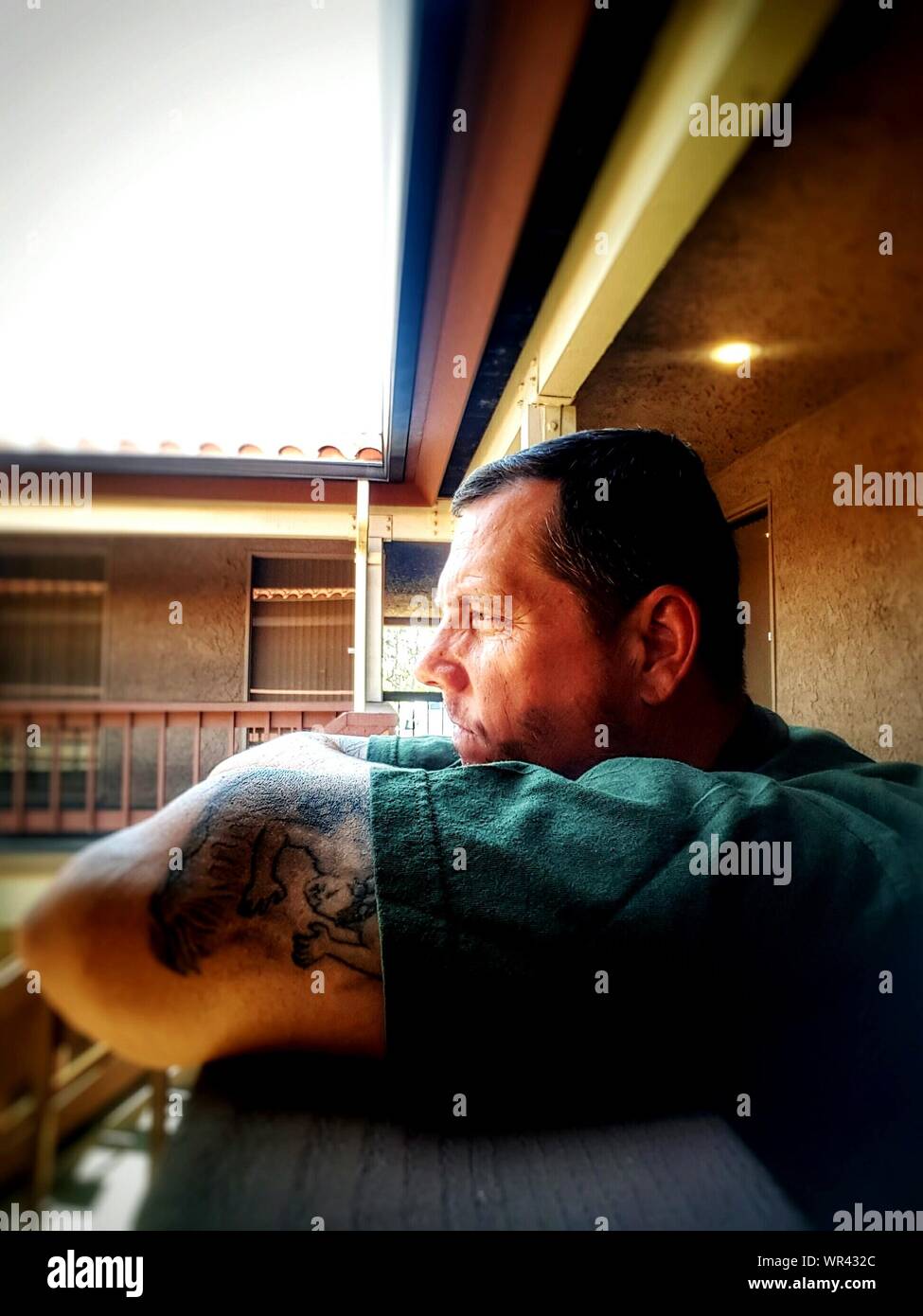 Man Leaning On Balcony Railing High Resolution Stock Photography and ...