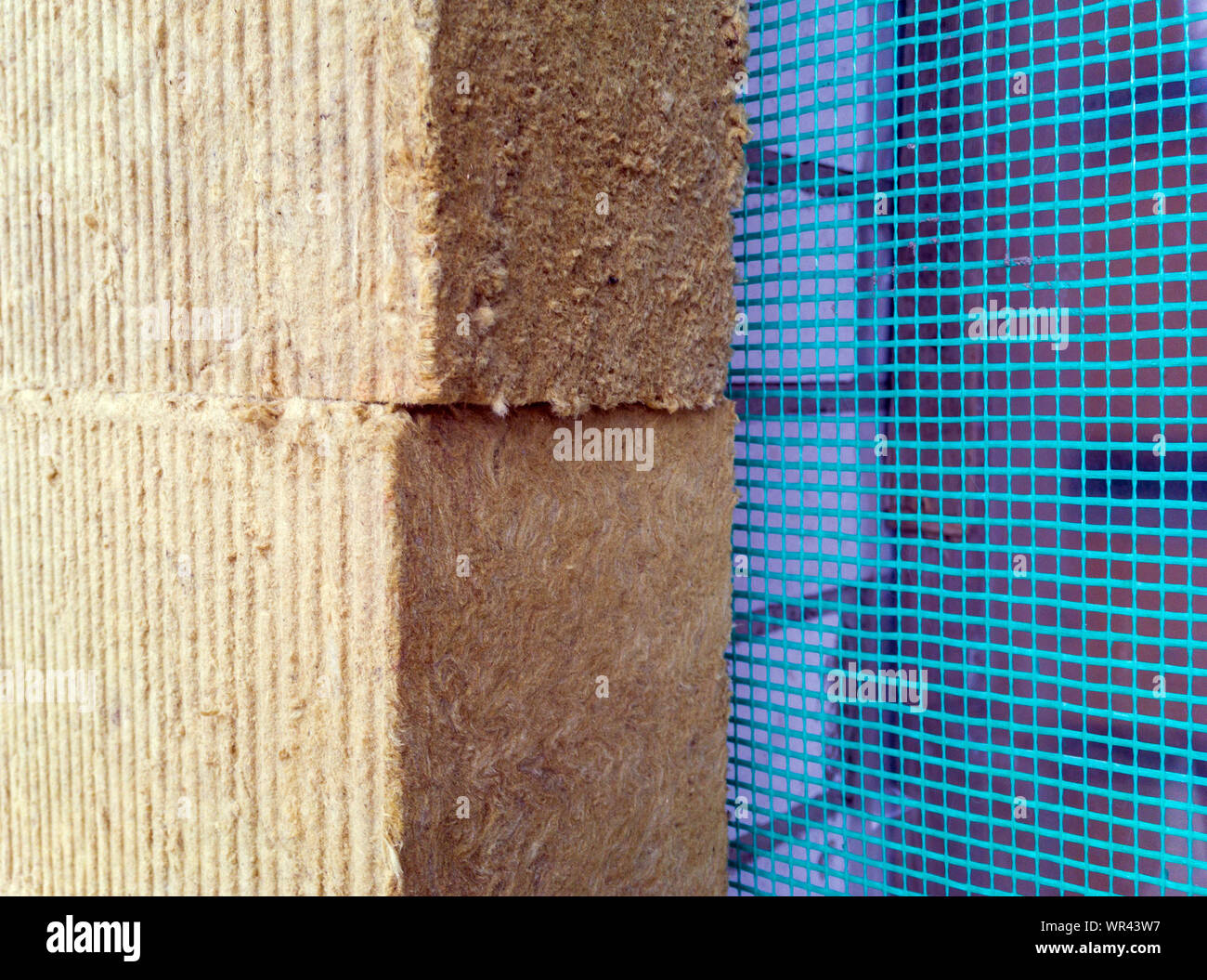Wall insulation with mineral wool slabs over a reinforcing mesh Stock ...