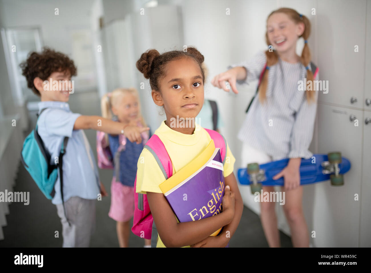 African-American schoolgirl feeling offended at school Stock Photo - Alamy