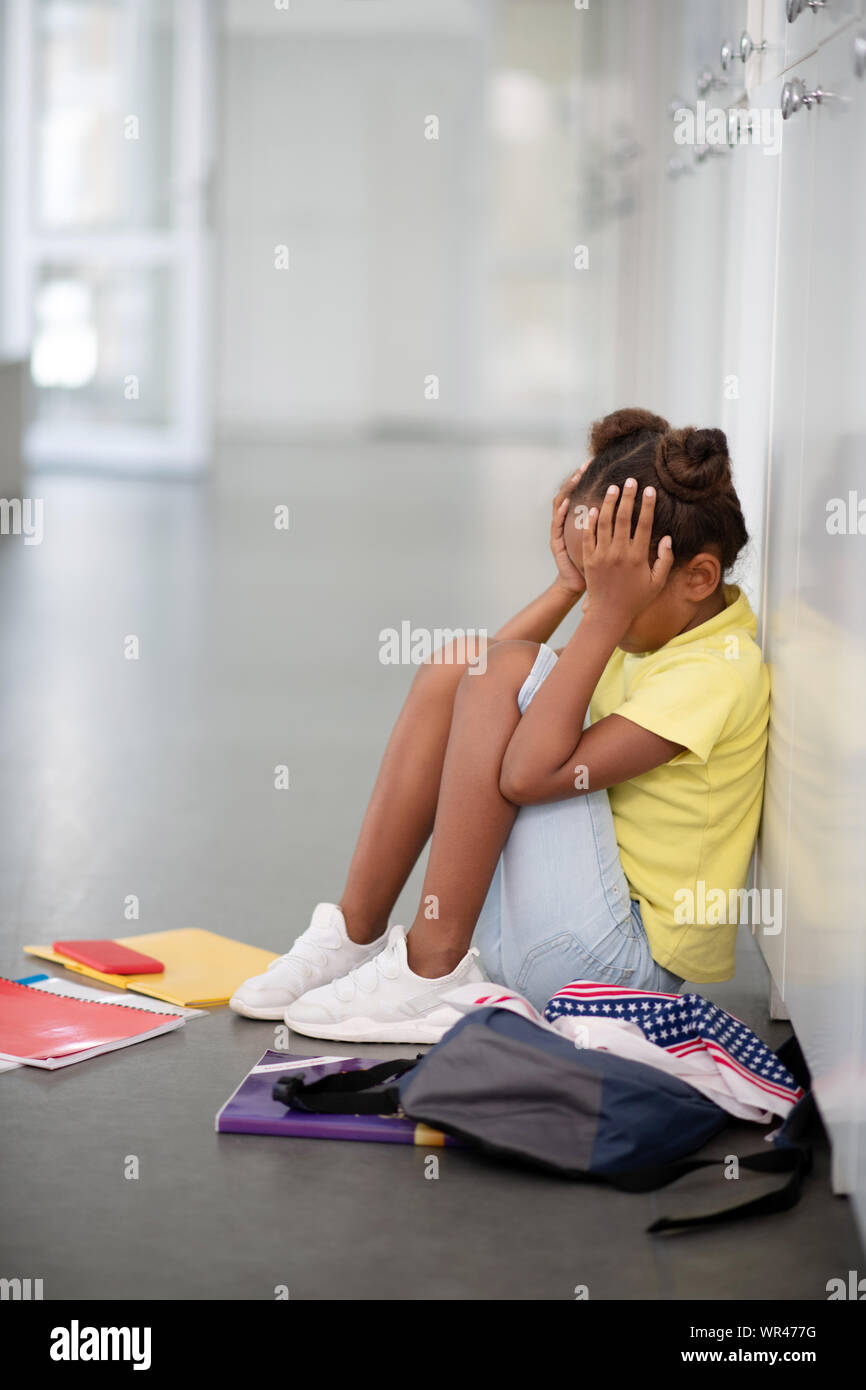 African-American girl crying after bullying by pupils Stock Photo - Alamy