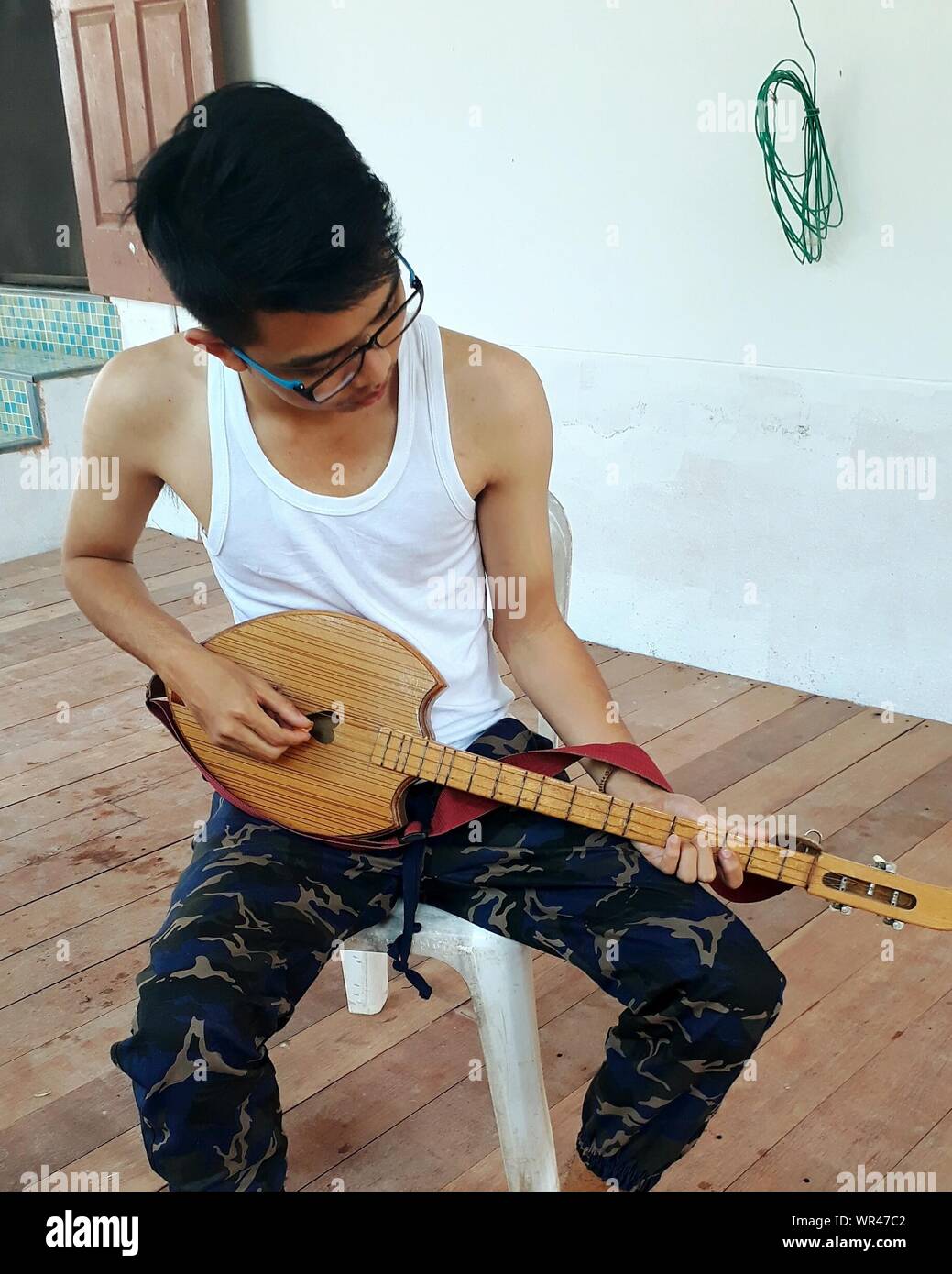 Playing an instrument hi-res stock photography and images - Alamy