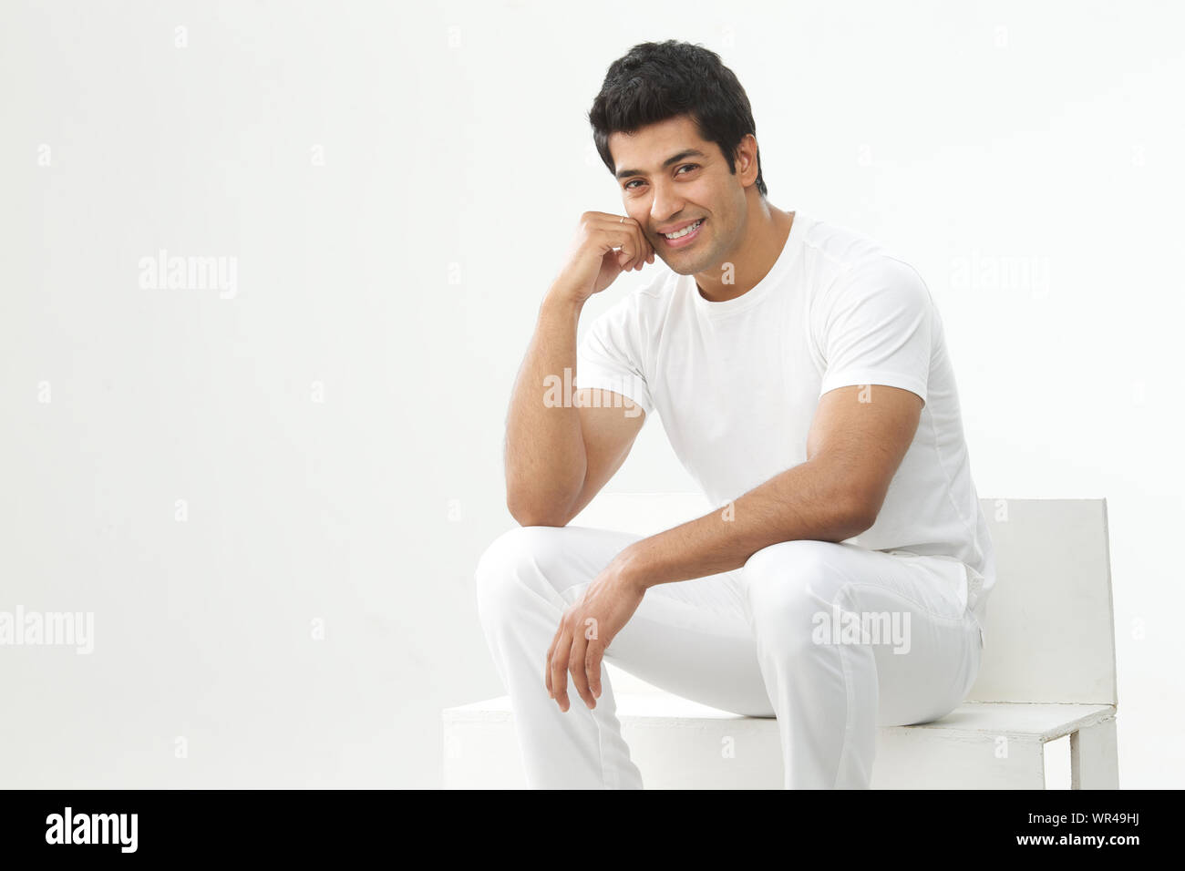 Beaming handsome young man hi-res stock photography and images - Alamy