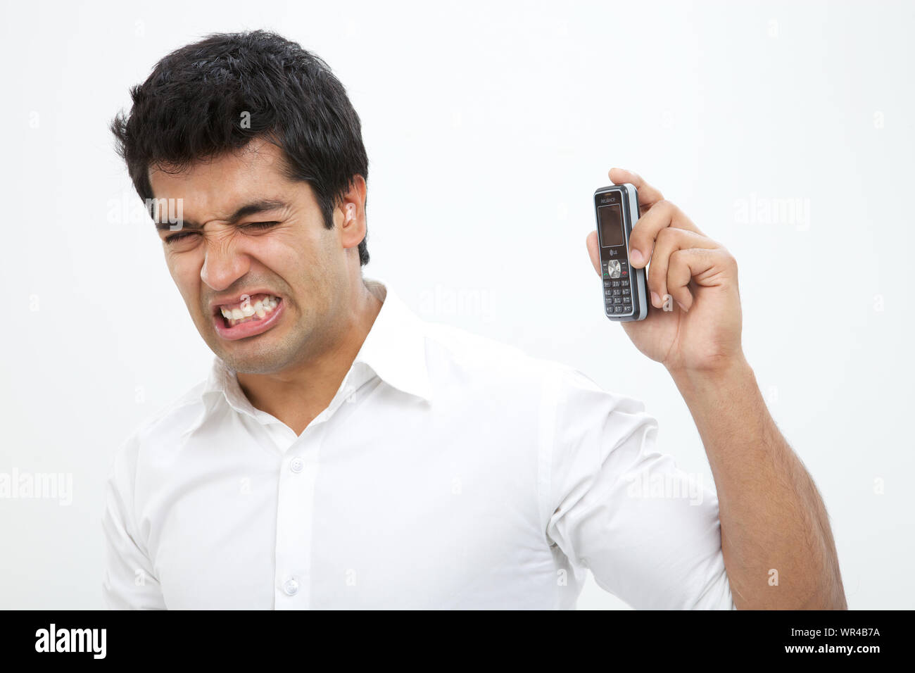 Young man holding mobile phone hi-res stock photography and images - Alamy