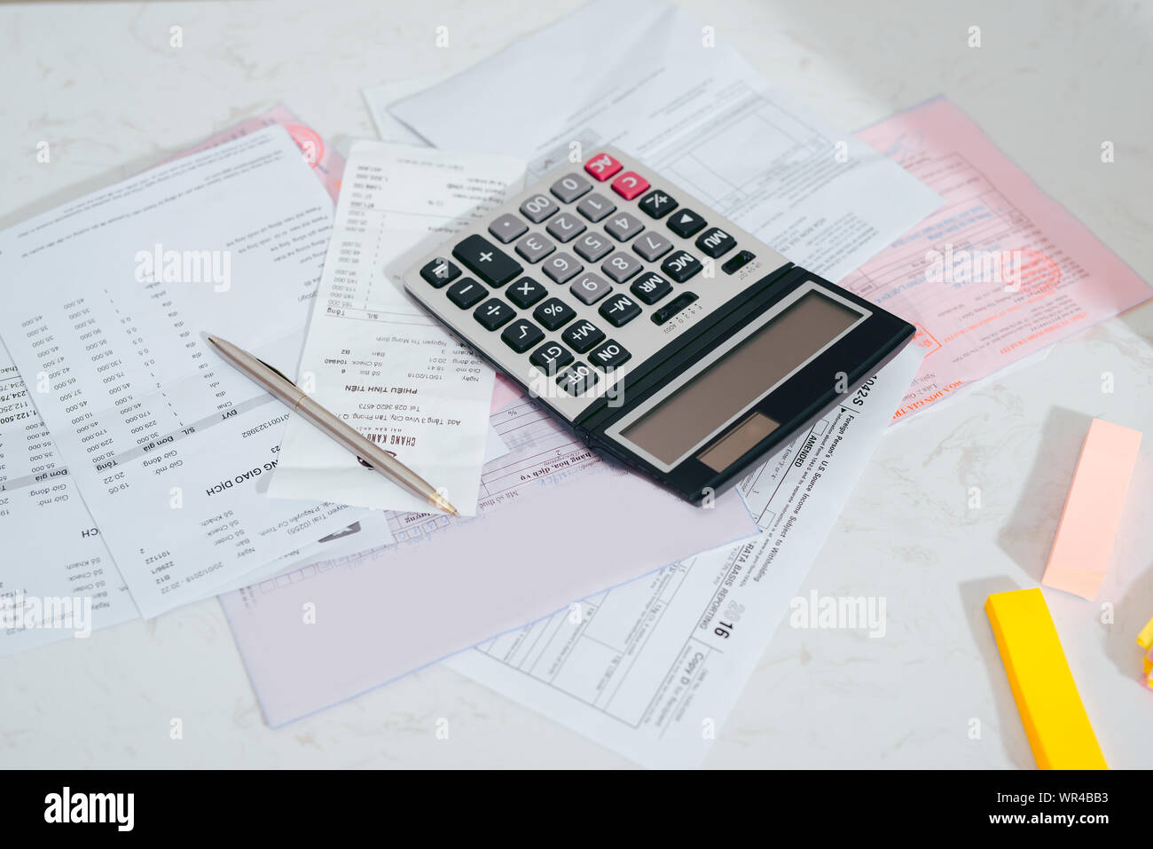 Calculate, analyze report results on office desk Stock Photo - Alamy