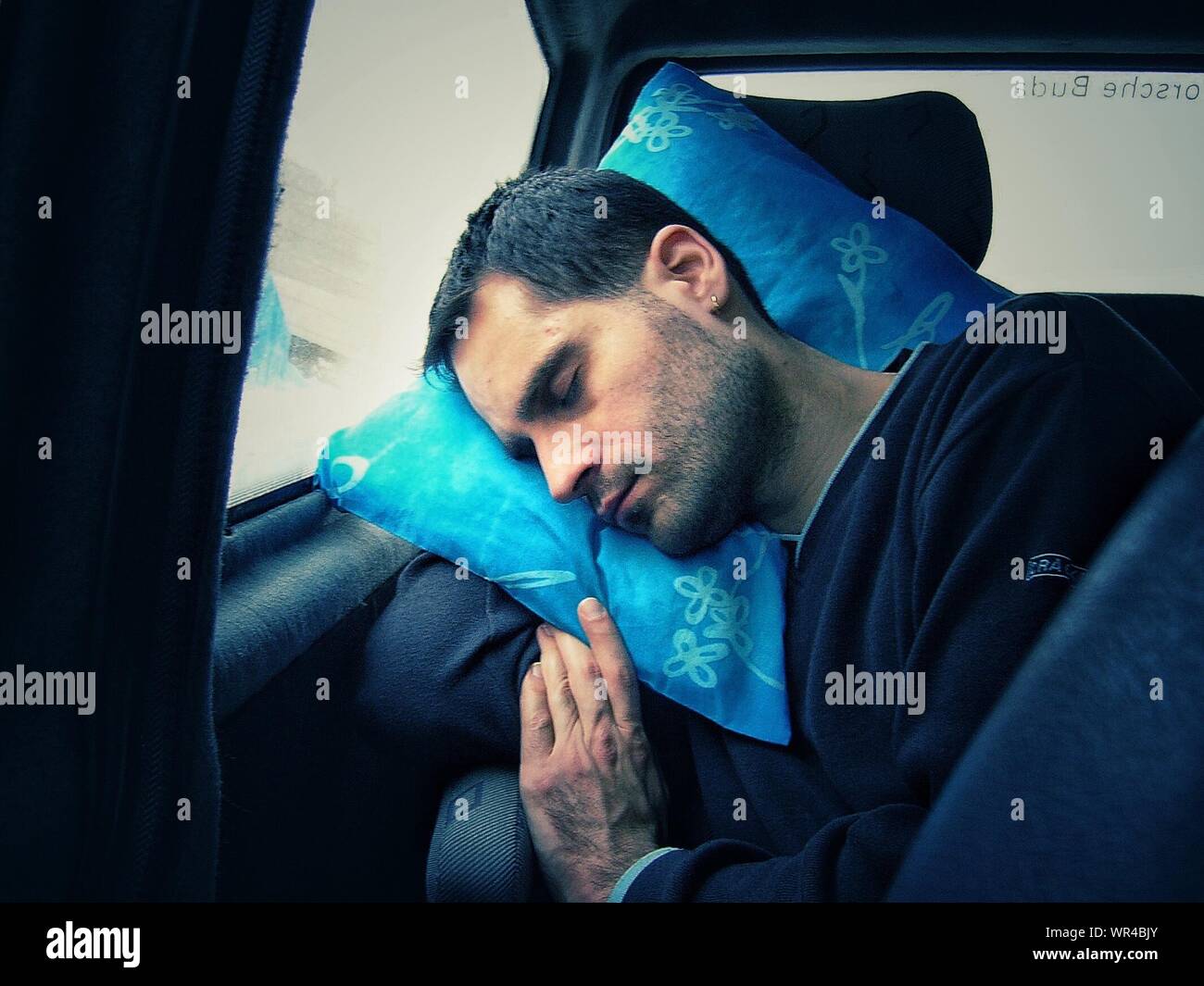 Man sleeping in vehicle hi-res stock photography and images - Alamy