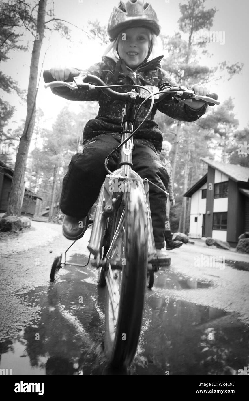 Girl riding bicycle low angle hi-res stock photography and images - Alamy