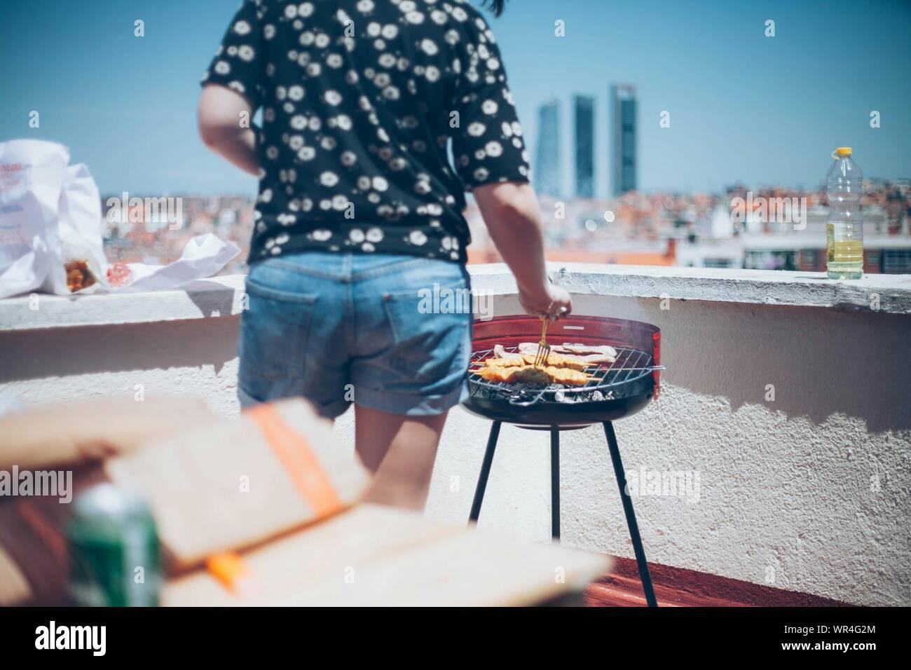 Woman Cooking On Barbecue Grill Stock Photo - Alamy