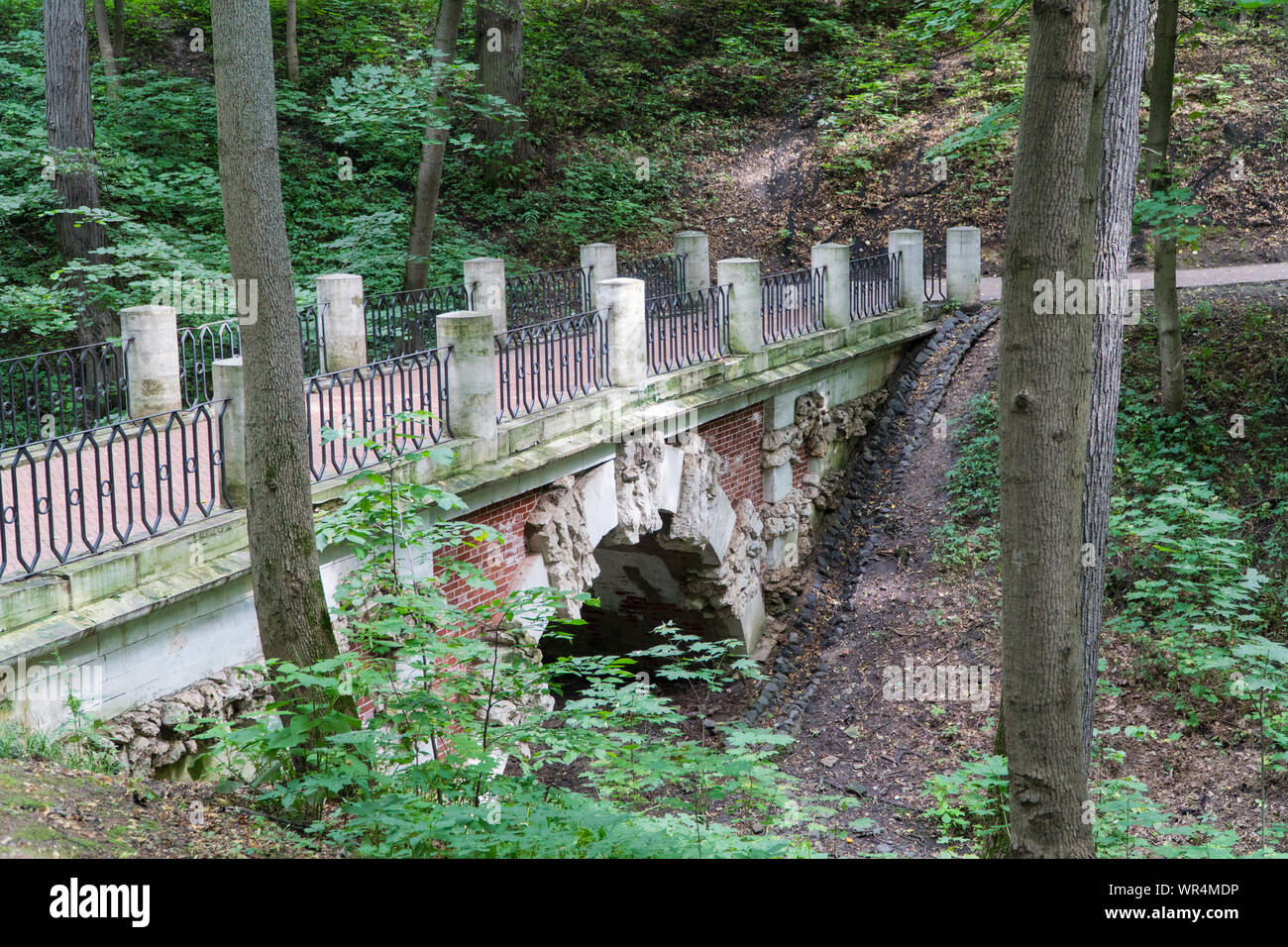 ancient stone bridge in the green park Stock Photo - Alamy