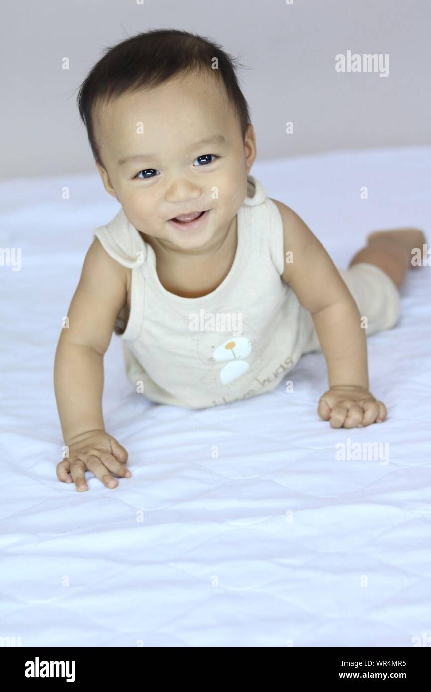 Baby lying happy hi-res stock photography and images - Alamy